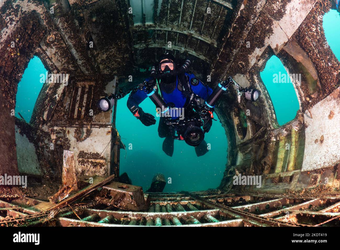 Scuba diver on a closed circuit rebreather and underwater camera ...