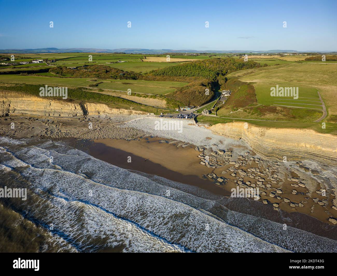 Aerial view of the limestone cliffs and beach at Southerndown and ...