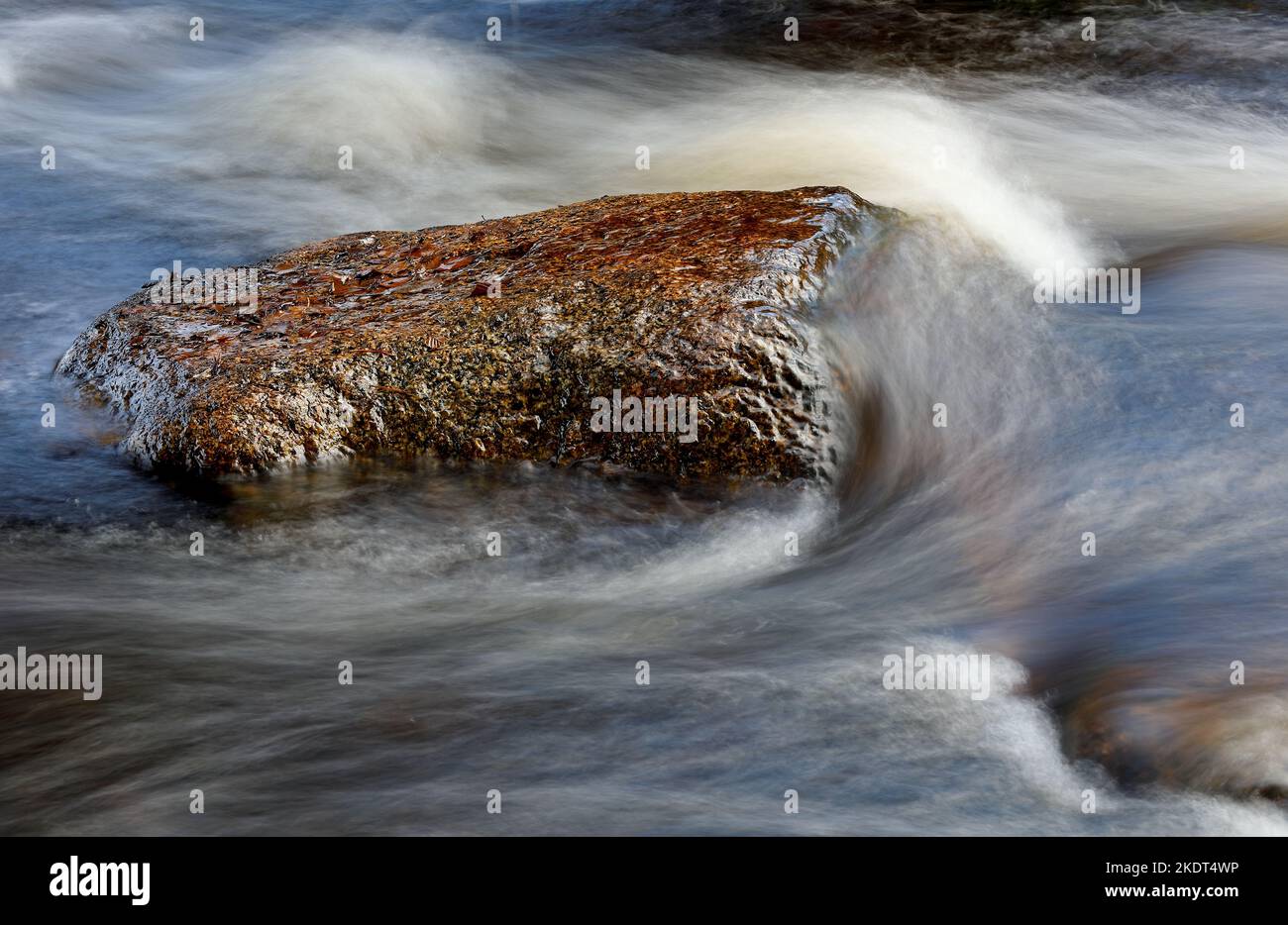 Water flows over rocks in rapids in slow motion Stock Photo - Alamy