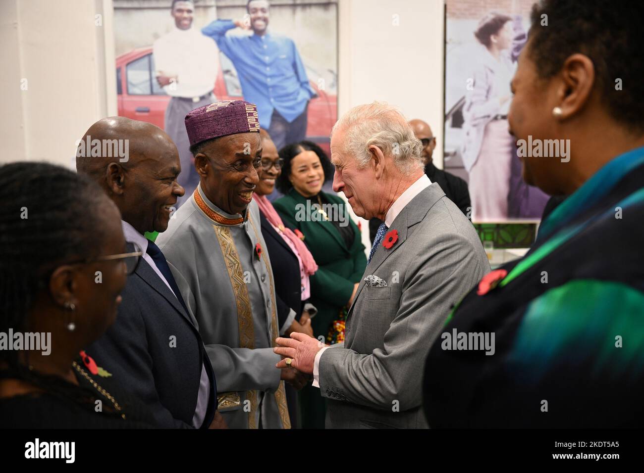 King Charles III talks with Arthur France, co-founder Leeds West indian ...