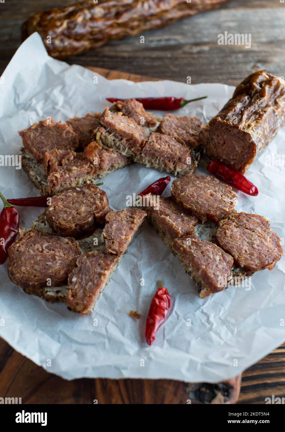 Rustic sandwich with homemade german salami on wooden table Stock Photo ...