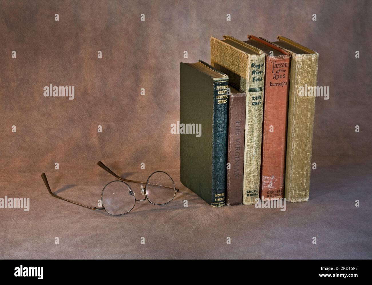 A stack of classic books waiting to be read, including Tarzan of the ...