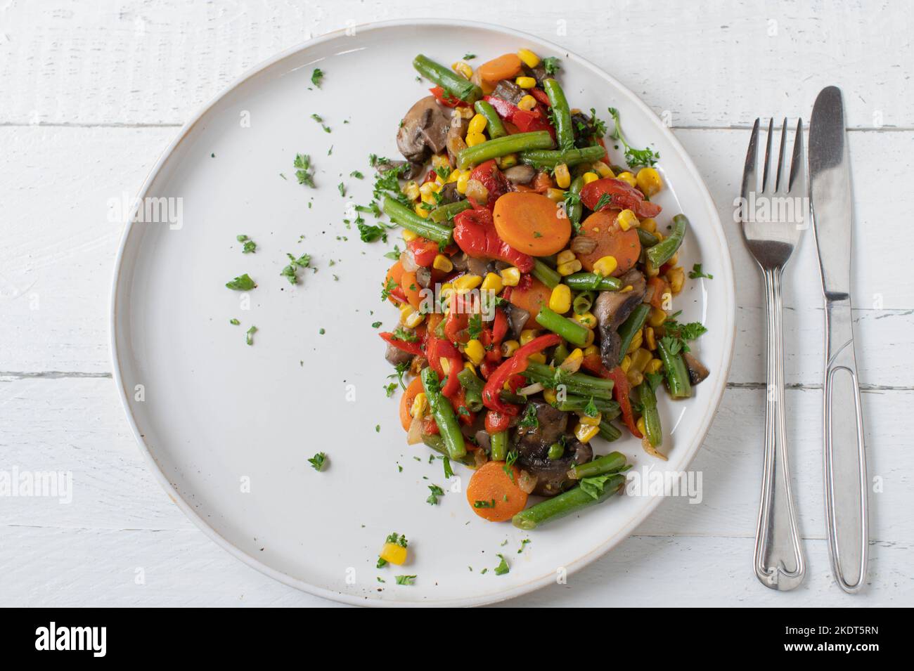 Cooked vegetables on a plate for healthy side dish isolated on white ...