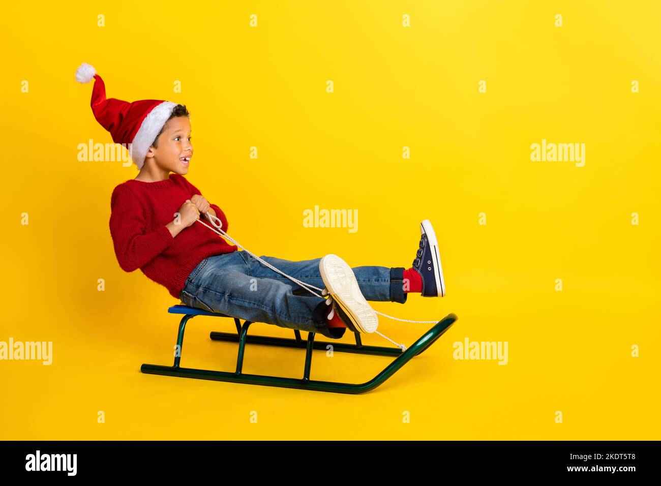 Full body photo of adorable small schoolboy sled have fun winter ...