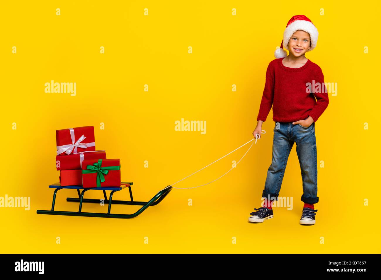 Full size photo of charming little boy pull santa claus sledge presents ...