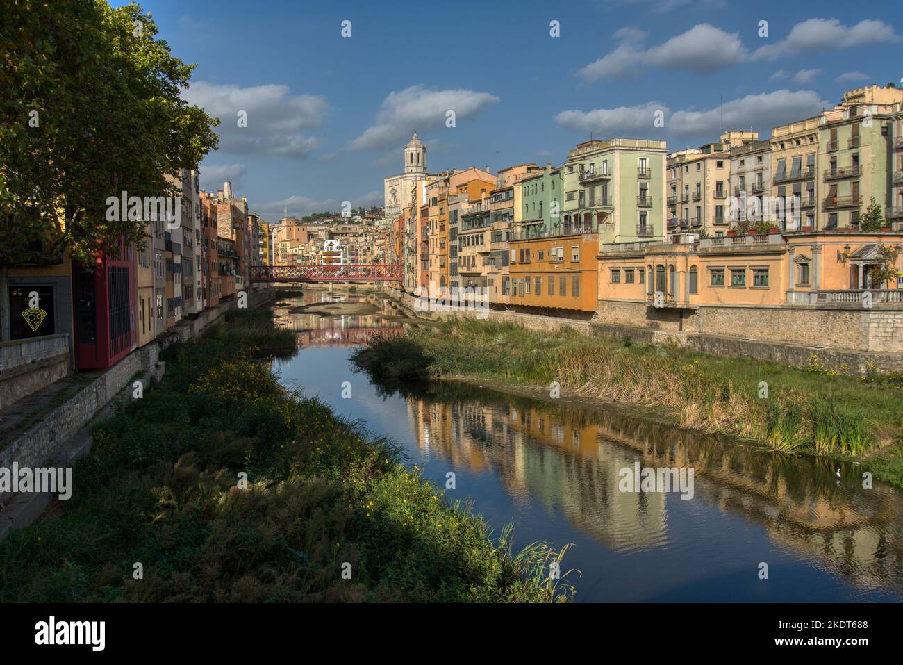 A view of the colourful buildings and Cathedral of Saint Mary of Girona ...