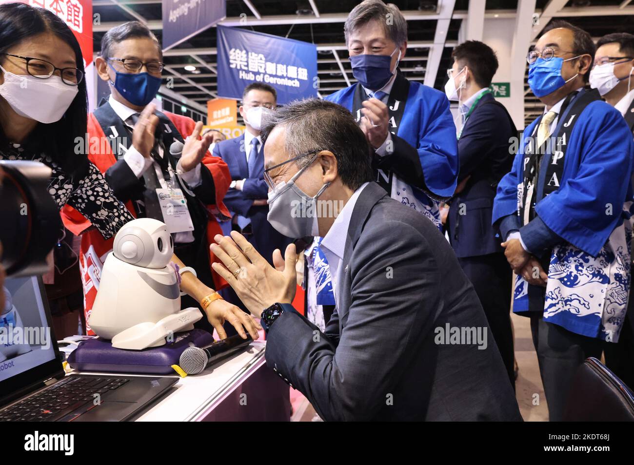EXCO member Lam Ching-choi tries the Social Robot at the Gerontech and Innovation Expo cum ...