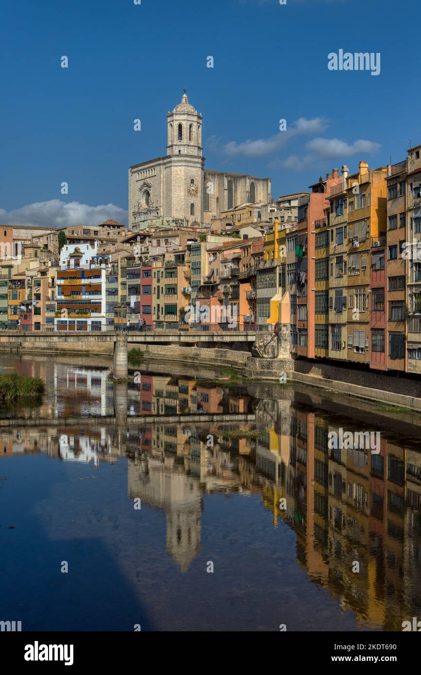 A view of the colourful buildings and Cathedral of Saint Mary of Girona ...