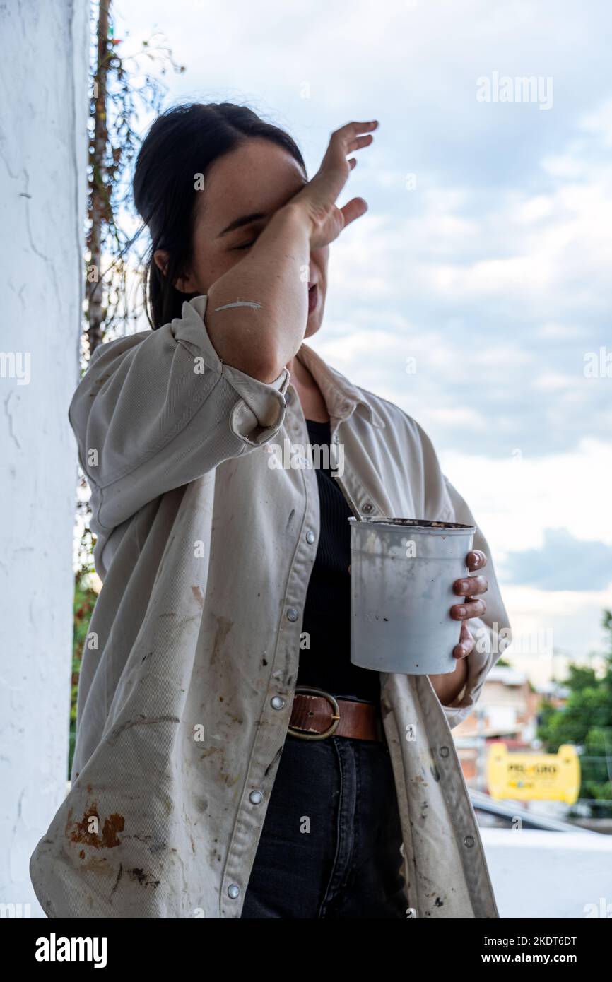 art workshop, messy objects, brushes, paint all mixed up disorganized ...