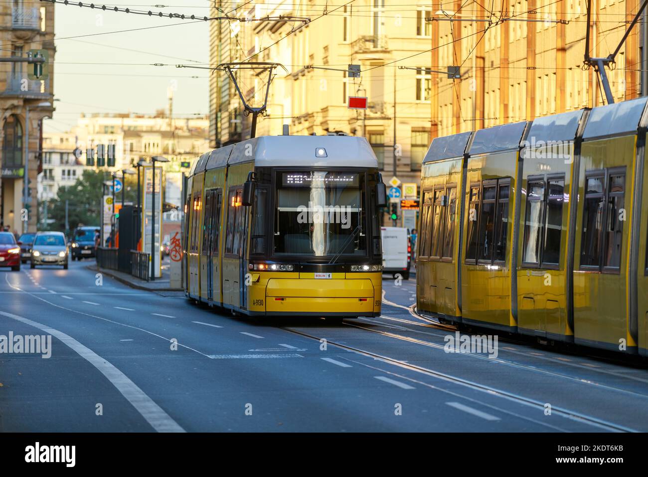 Berlin, Germany - October 7, 2022: Yellow tram drives along a street ...