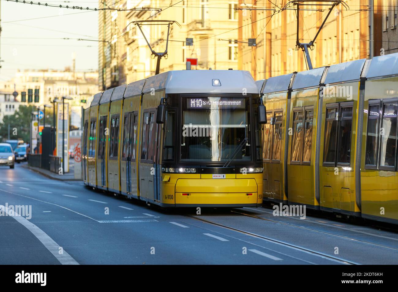 Berlin, Germany - October 7, 2022: Yellow tram drives along a street ...