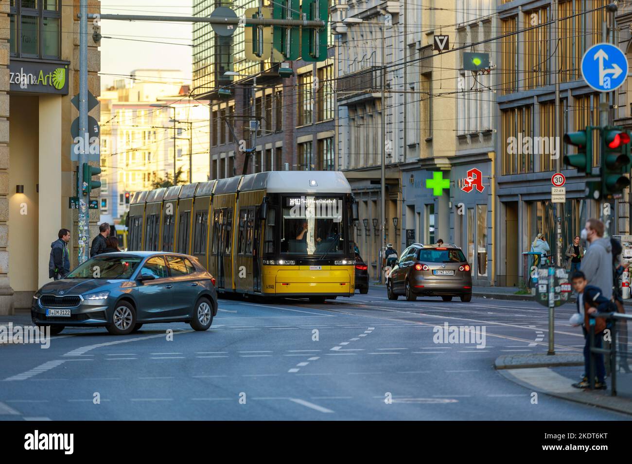 Berlin, Germany - October 7, 2022: Yellow tram drives along a street ...