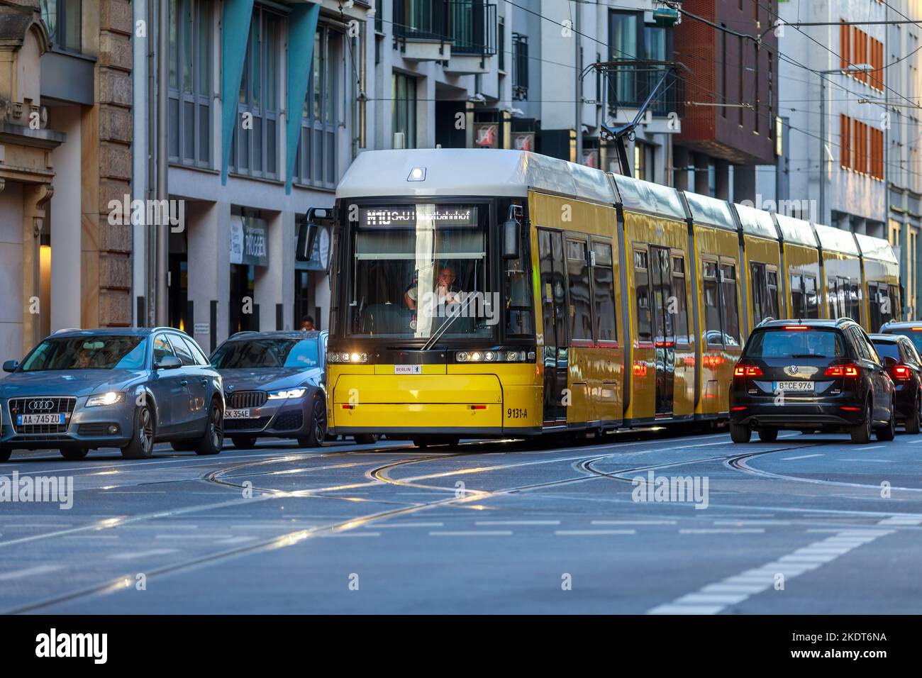 Berlin, Germany - October 7, 2022: Yellow tram drives along a street ...