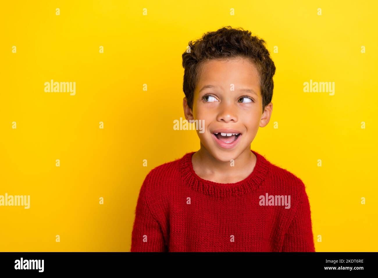 Photo portrait of adorable small schoolboy look curious empty space ...