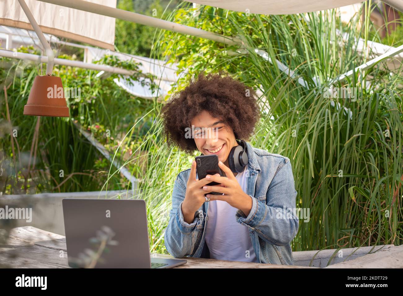 Smiling young mixed race Afro-Italian men in their 20s, dressed in ...