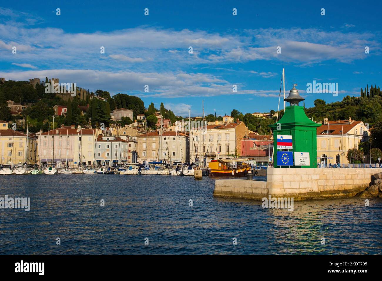Piran, Slovenia - September 17th 2022. A small green lighthouse on the ...