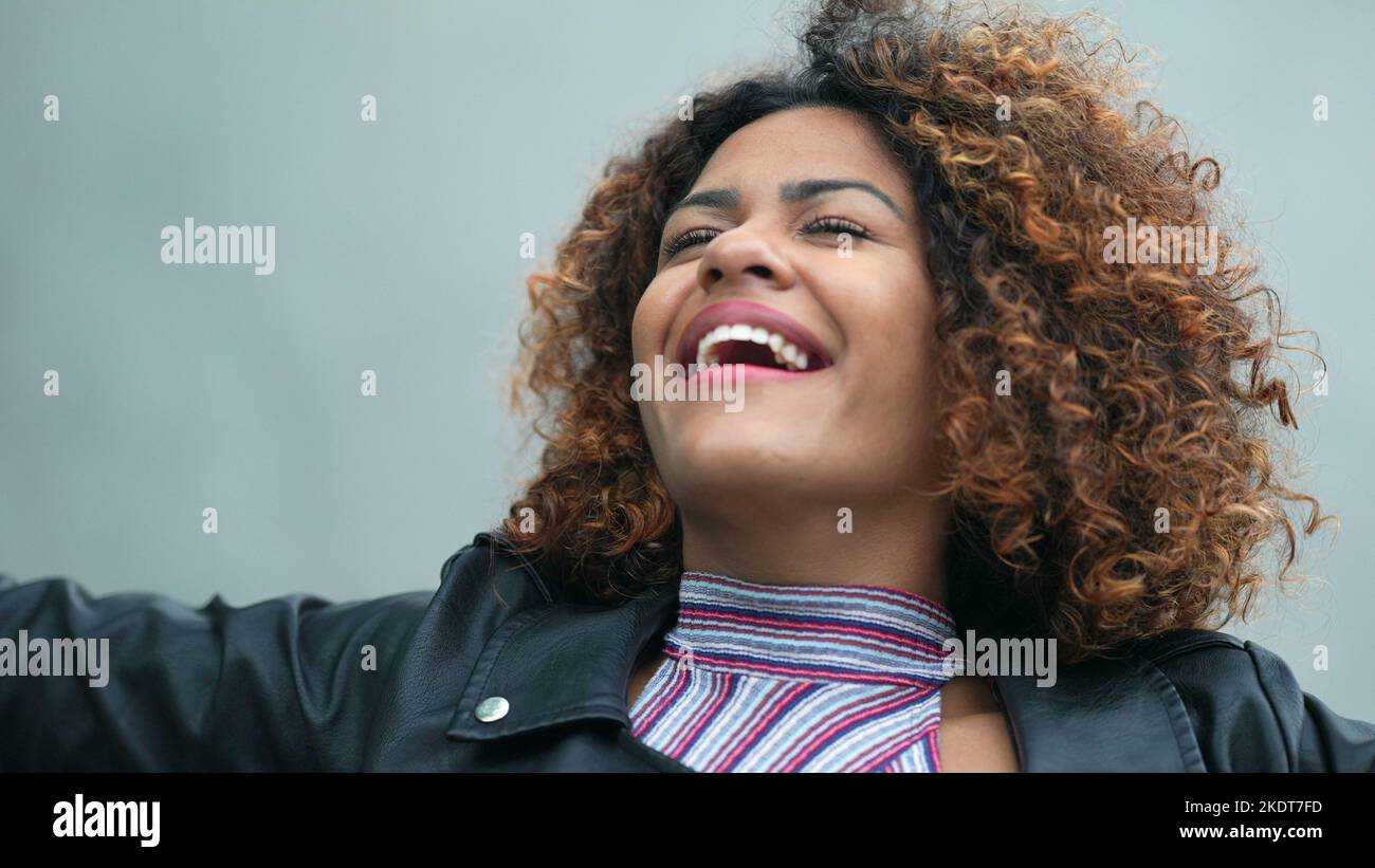 Carefree black woman portrait smiling feeling free Stock Photo - Alamy