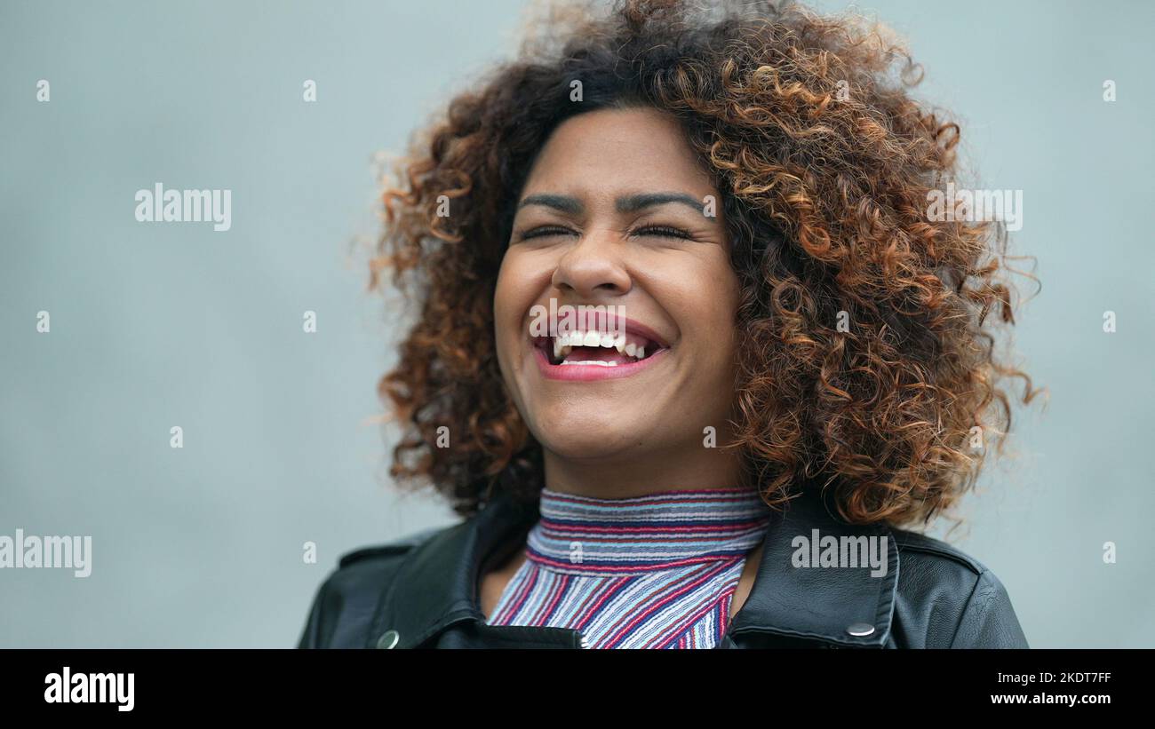 Carefree black woman portrait smiling feeling free Stock Photo - Alamy