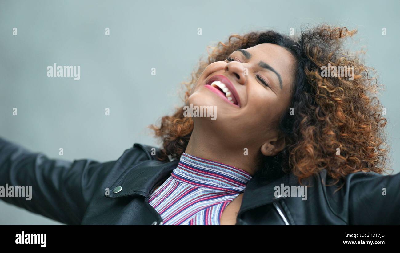 Carefree black woman portrait smiling feeling free Stock Photo - Alamy