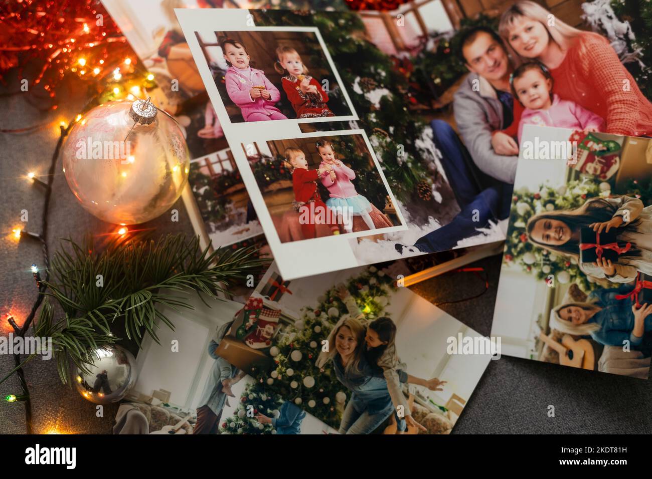 Photos of family against Christmas lights decor background Stock Photo ...