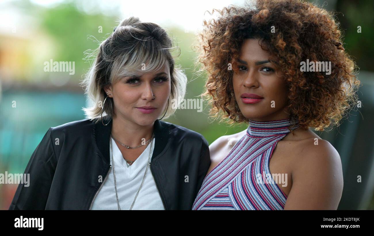 Two diverse women portrait faces looking at camera Stock Photo - Alamy