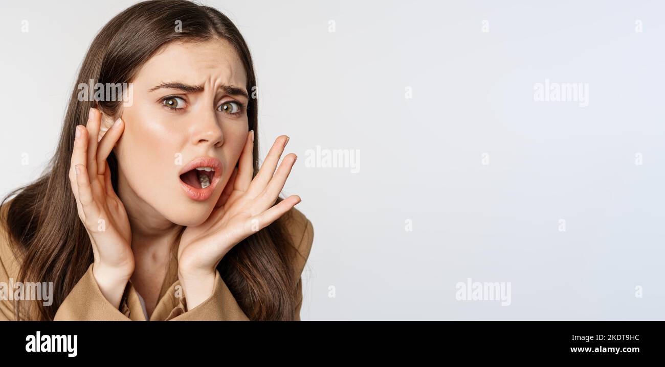 Image of sad girl looking in mirror and touching facial skin, shocked ...