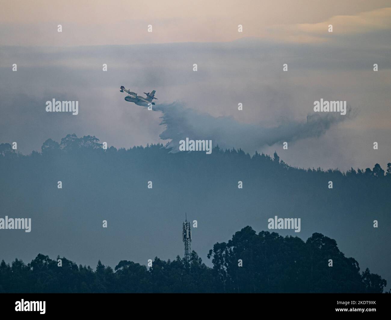 Fire extinguishing plane water bomber dumping its load, Spain Stock ...