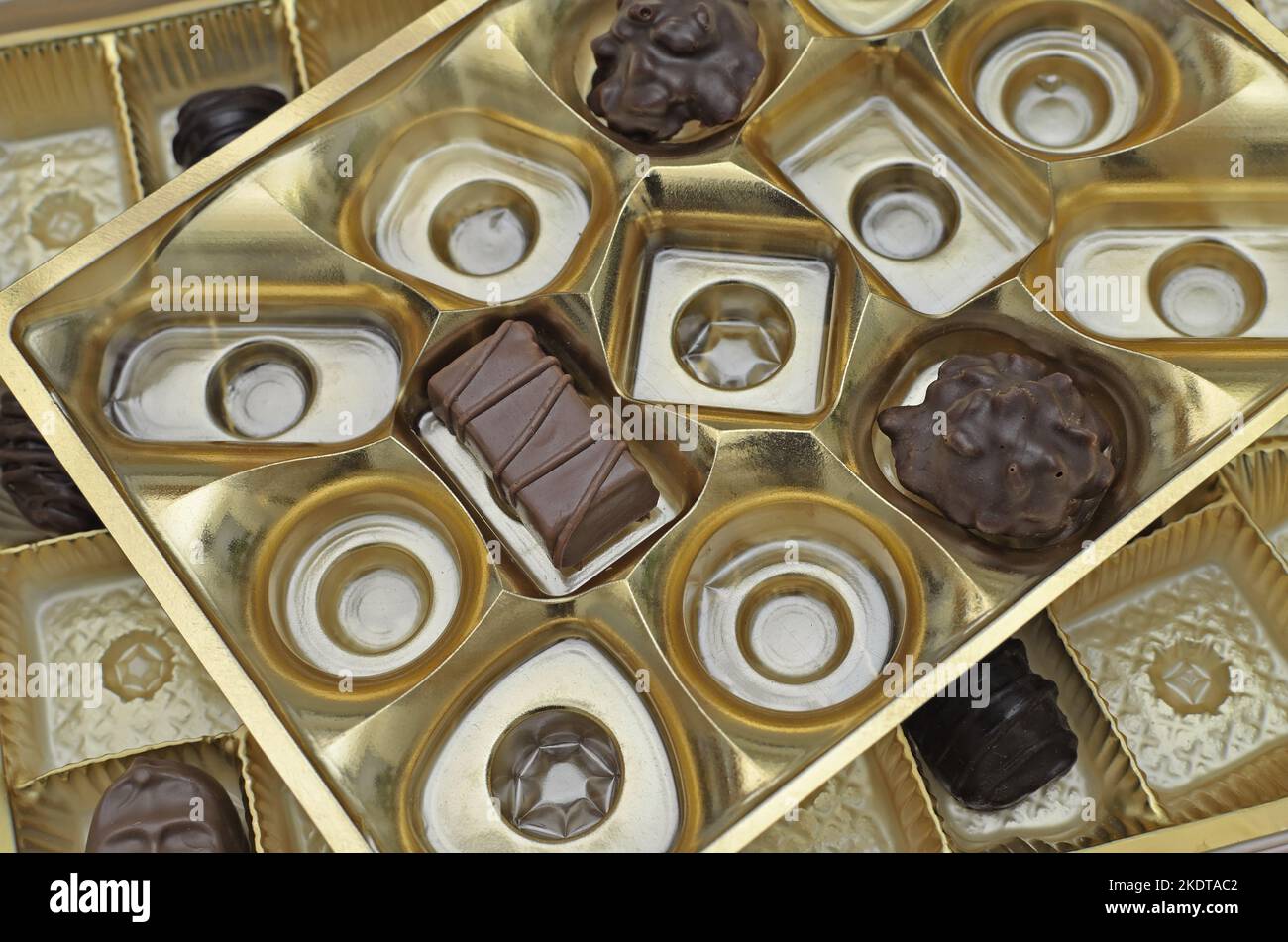 two boxes with chocolates, half-empty, close up, macro, full frame, top ...