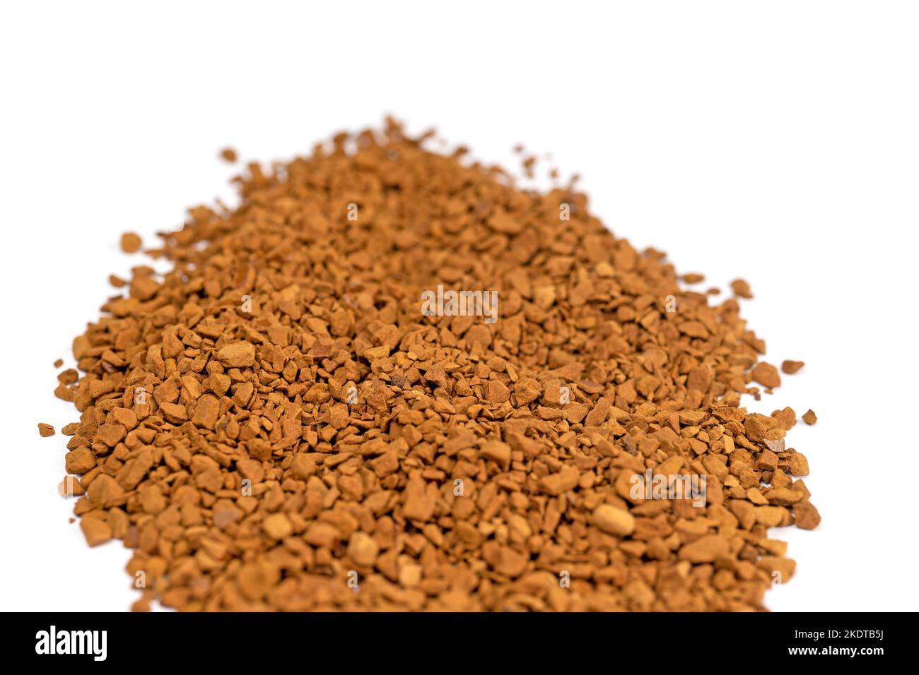 Instant coffee beans against a white background Stock Photo - Alamy