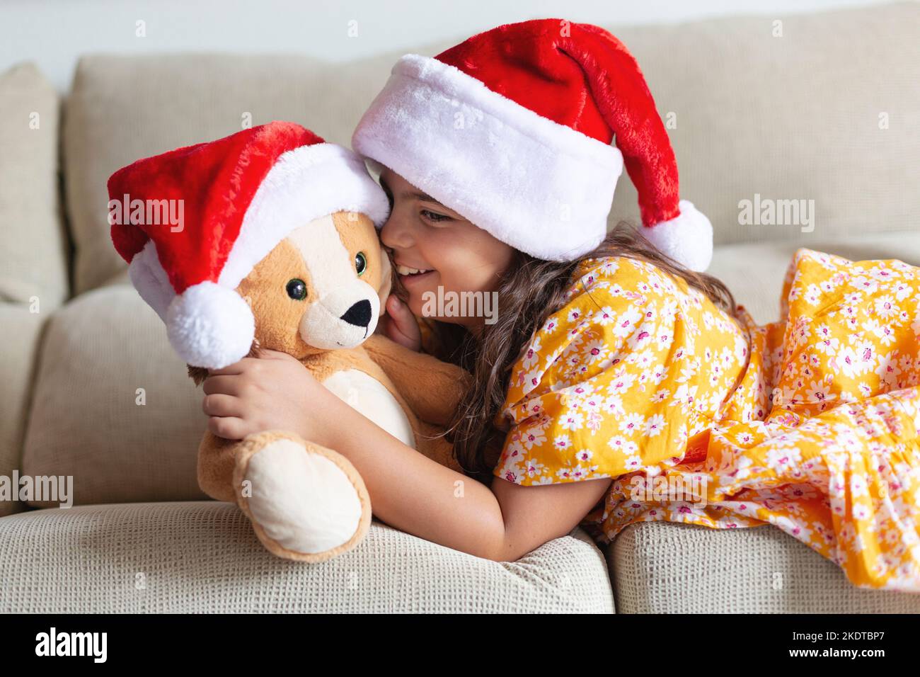 Girl playing with teddy bear hi-res stock photography and images - Alamy