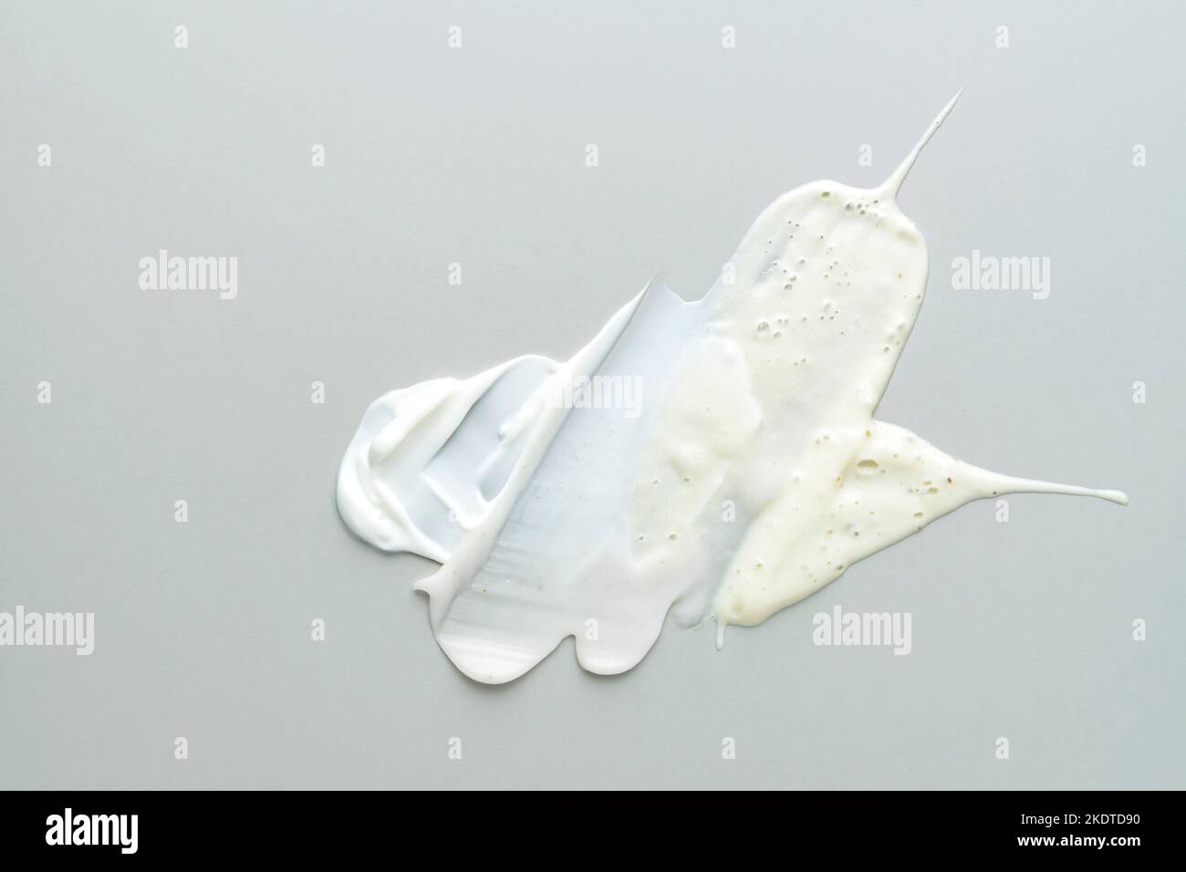 Beauty skin care product textures on gray background. Face cream ...