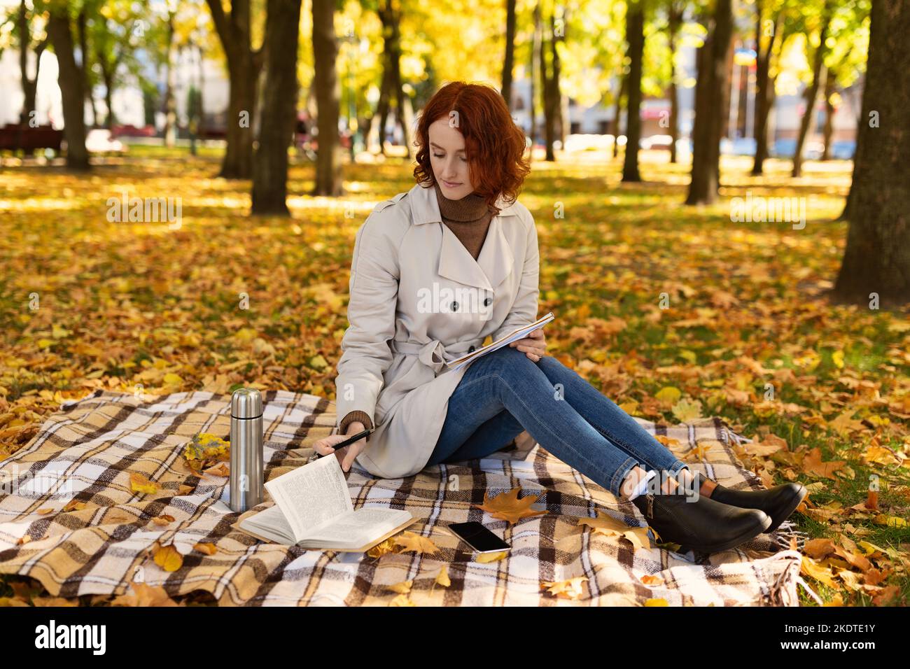 Concentrated smart caucasian pretty millennial lady student with red ...