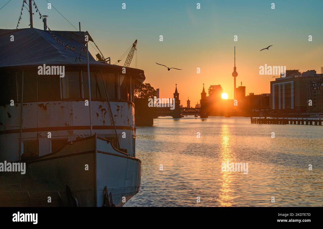 Berlin skyline during sunset with a view of the Oberbaum Bridge and the ...