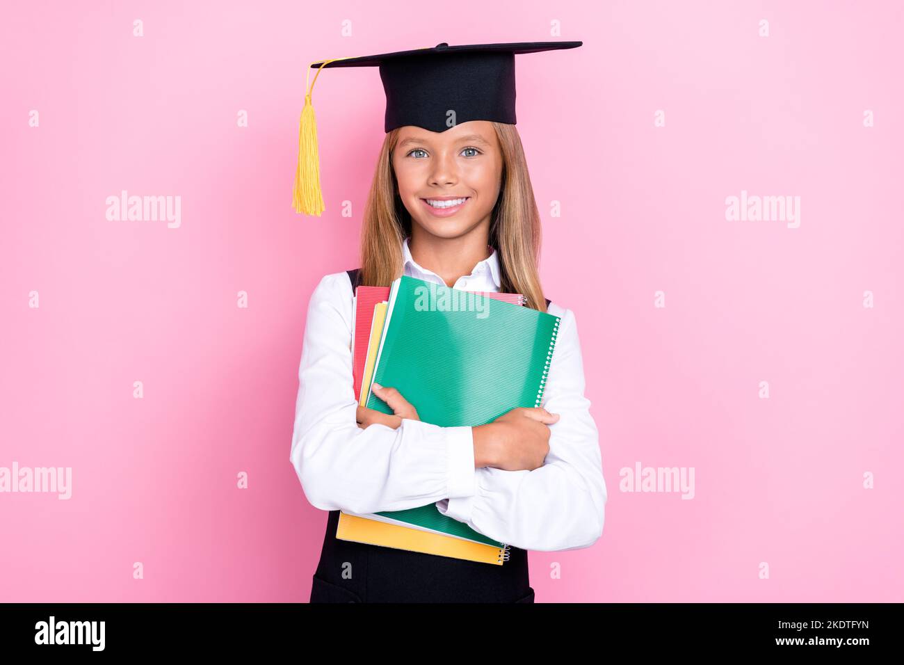 Photo of intelligent cute little genius kid hold book graduate first ...