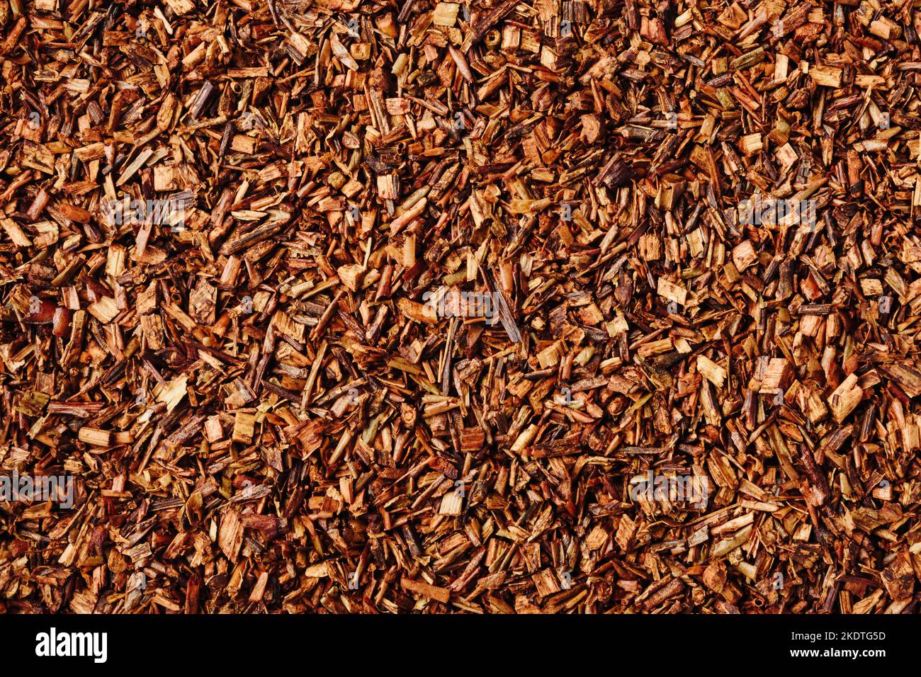 Dry leaves of red rooibos tea, texture background closeup Stock Photo ...