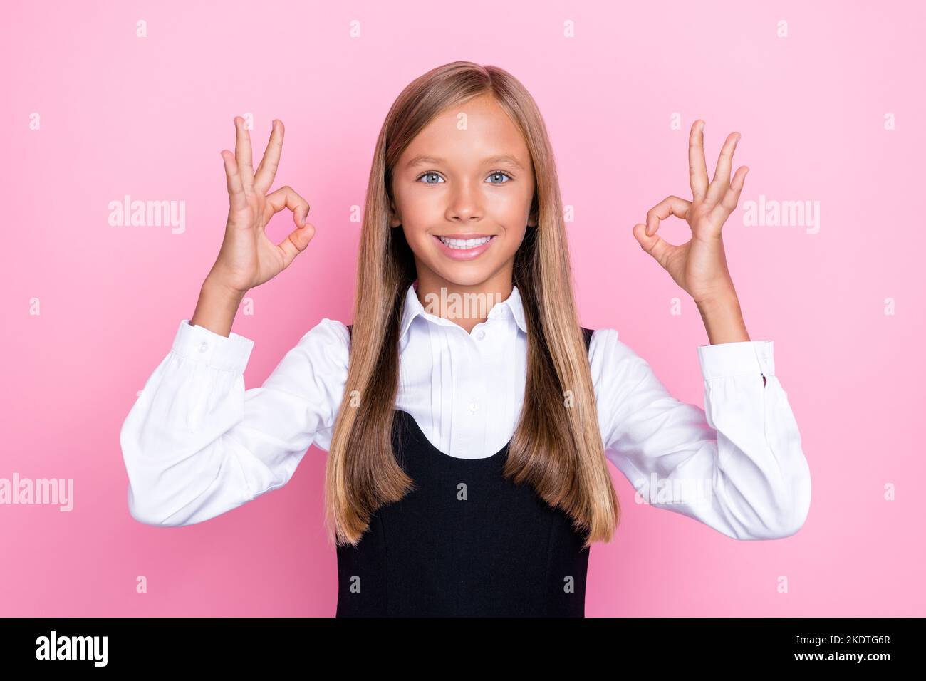Closeup photo of young little small cute schoolkid wear uniform showing ...