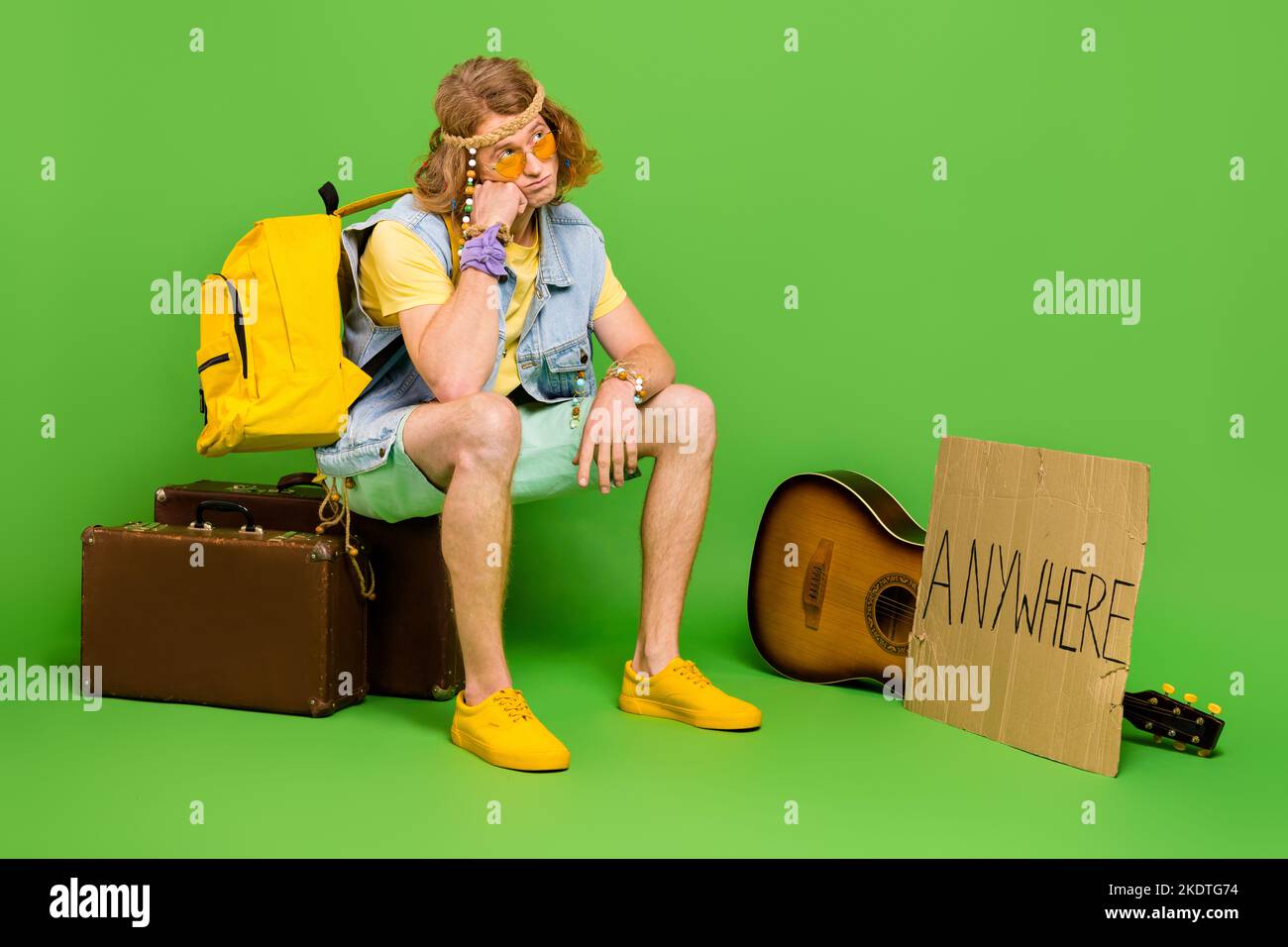 Full body portrait of unsatisfied minded person sitting suitcase ...