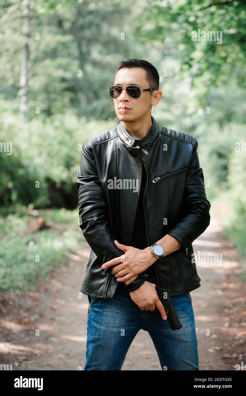 Muscular man in leather jacket hi-res stock photography and images - Alamy