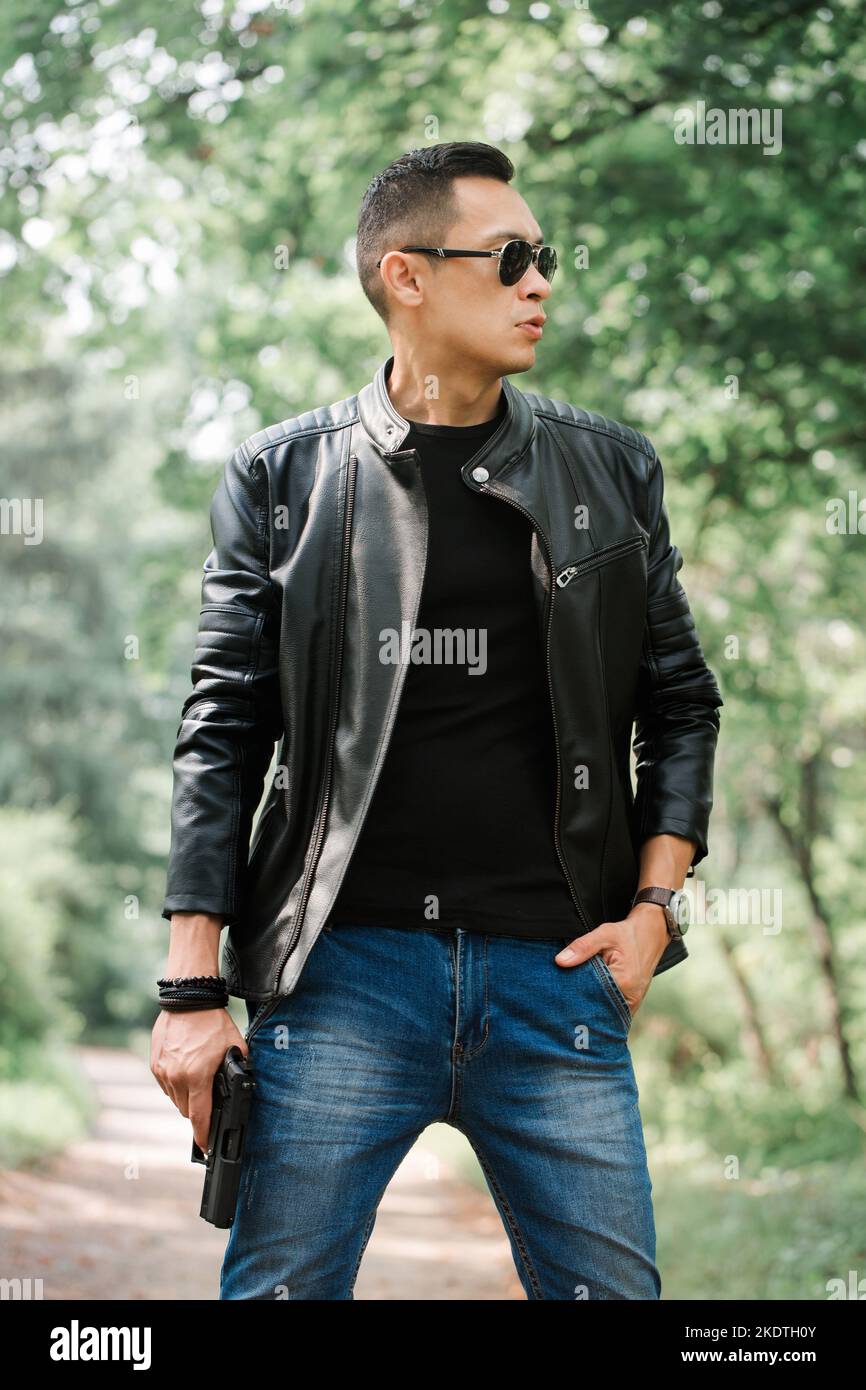 Muscular man in leather jacket hi-res stock photography and images - Alamy
