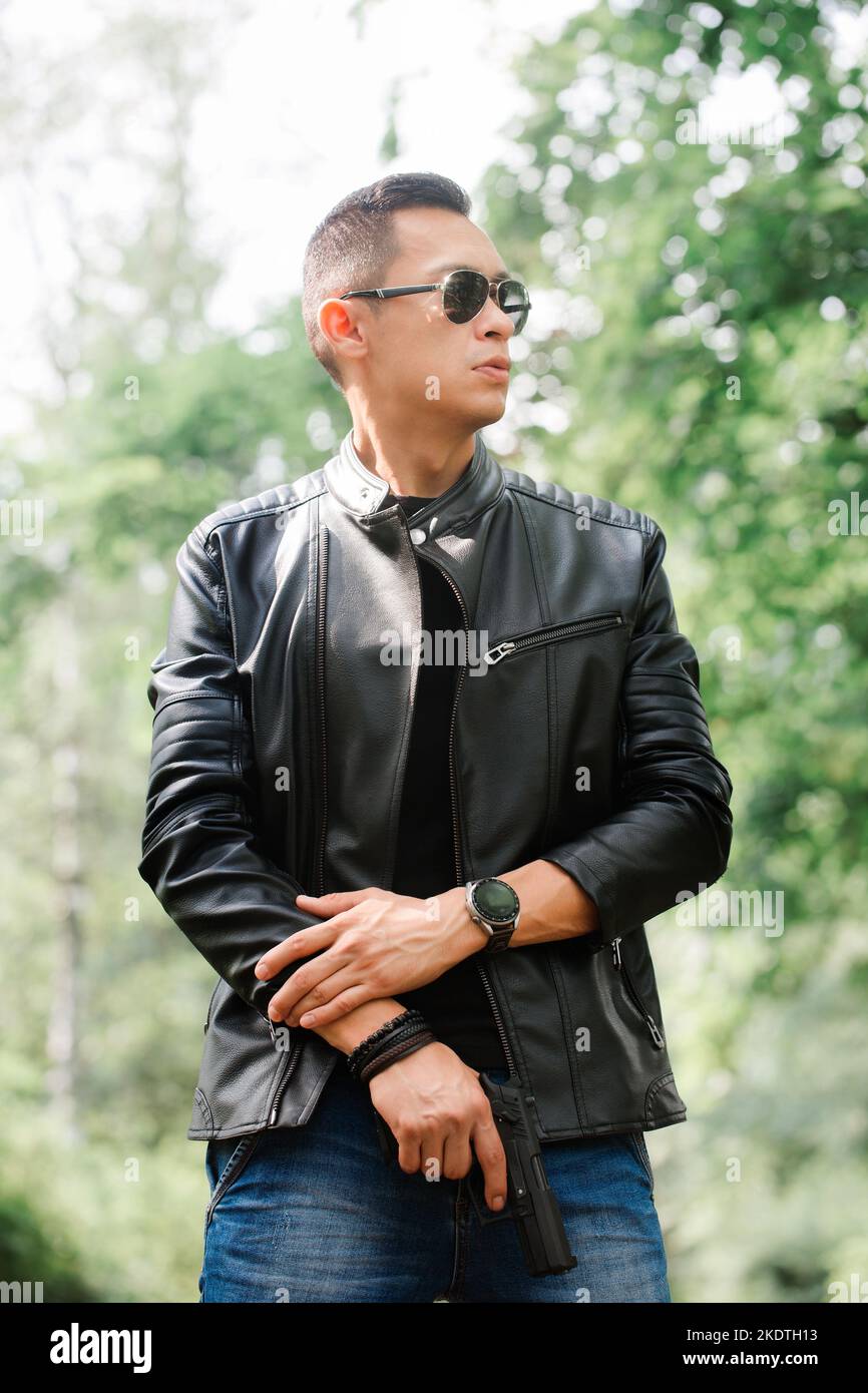 Muscular man in leather jacket hi-res stock photography and images - Alamy