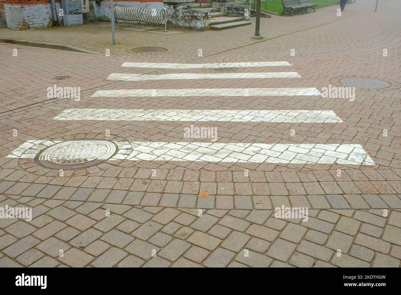 Pedestrian crossing on a small paved road. Safe pedestrian movement ...