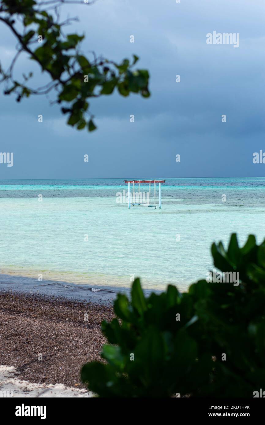 A picture of a swing in the shallow sea in Maldives, picture is taken ...