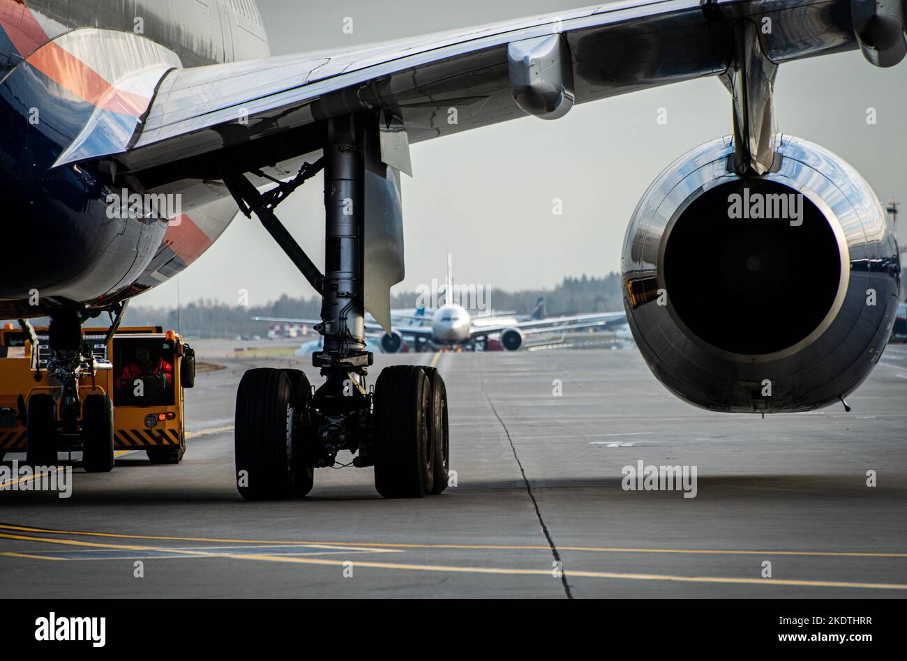 Jet engine under the wing of a modern passenger aircraft at an ...