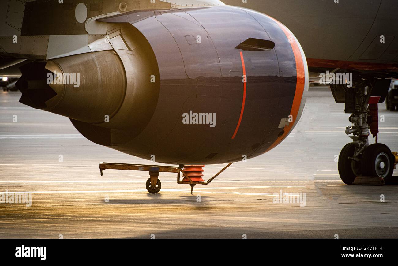 Jet engine under the wing of a modern passenger aircraft at an ...