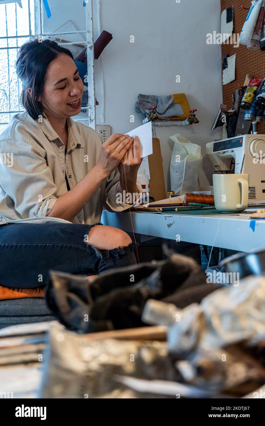art workshop, messy objects, brushes, paint all mixed up disorganized ...