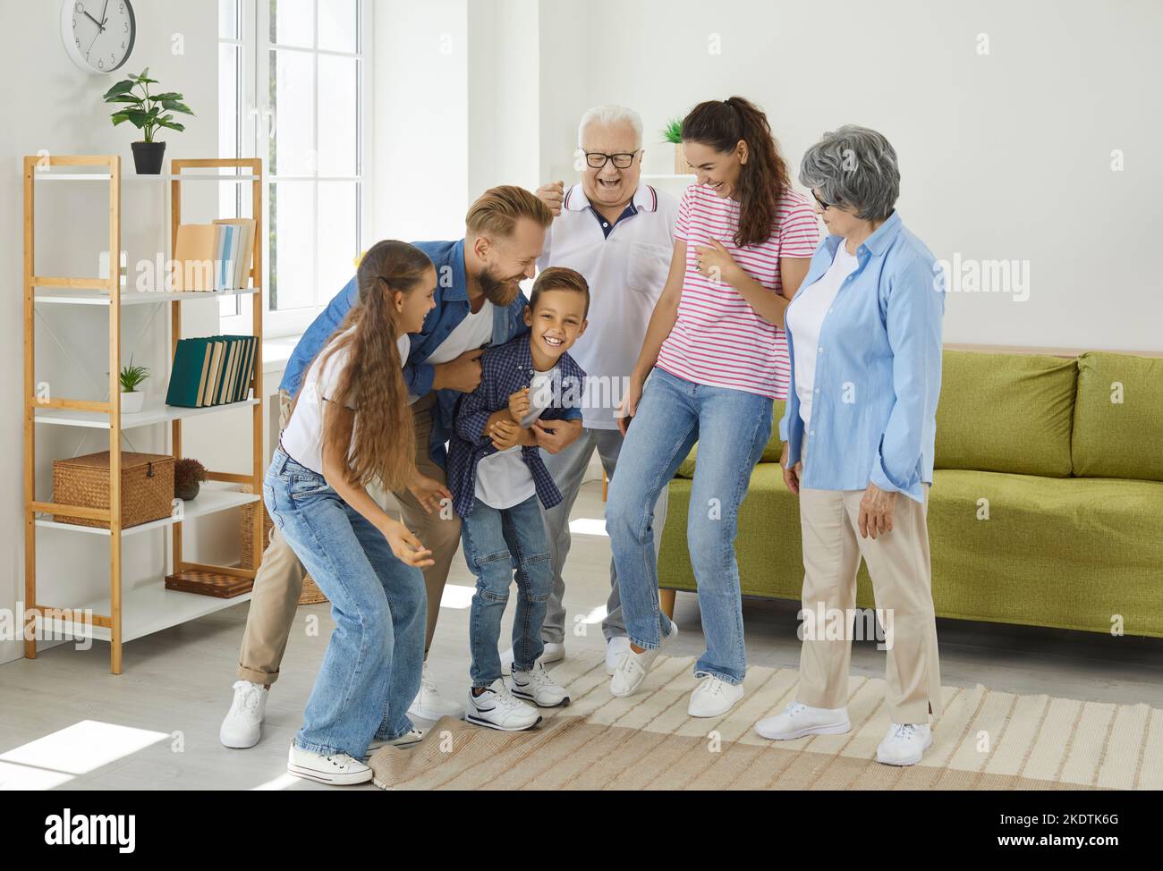 Happy, cheerful children, parents and grandparents playing and having ...