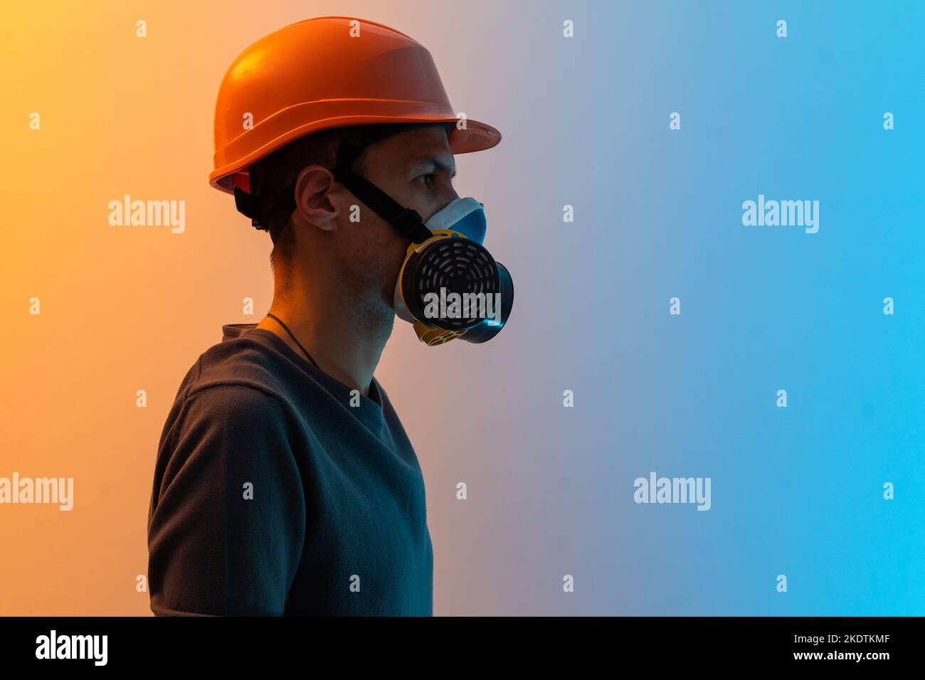a man in a mask with a filter and a helmet color background Stock Photo ...