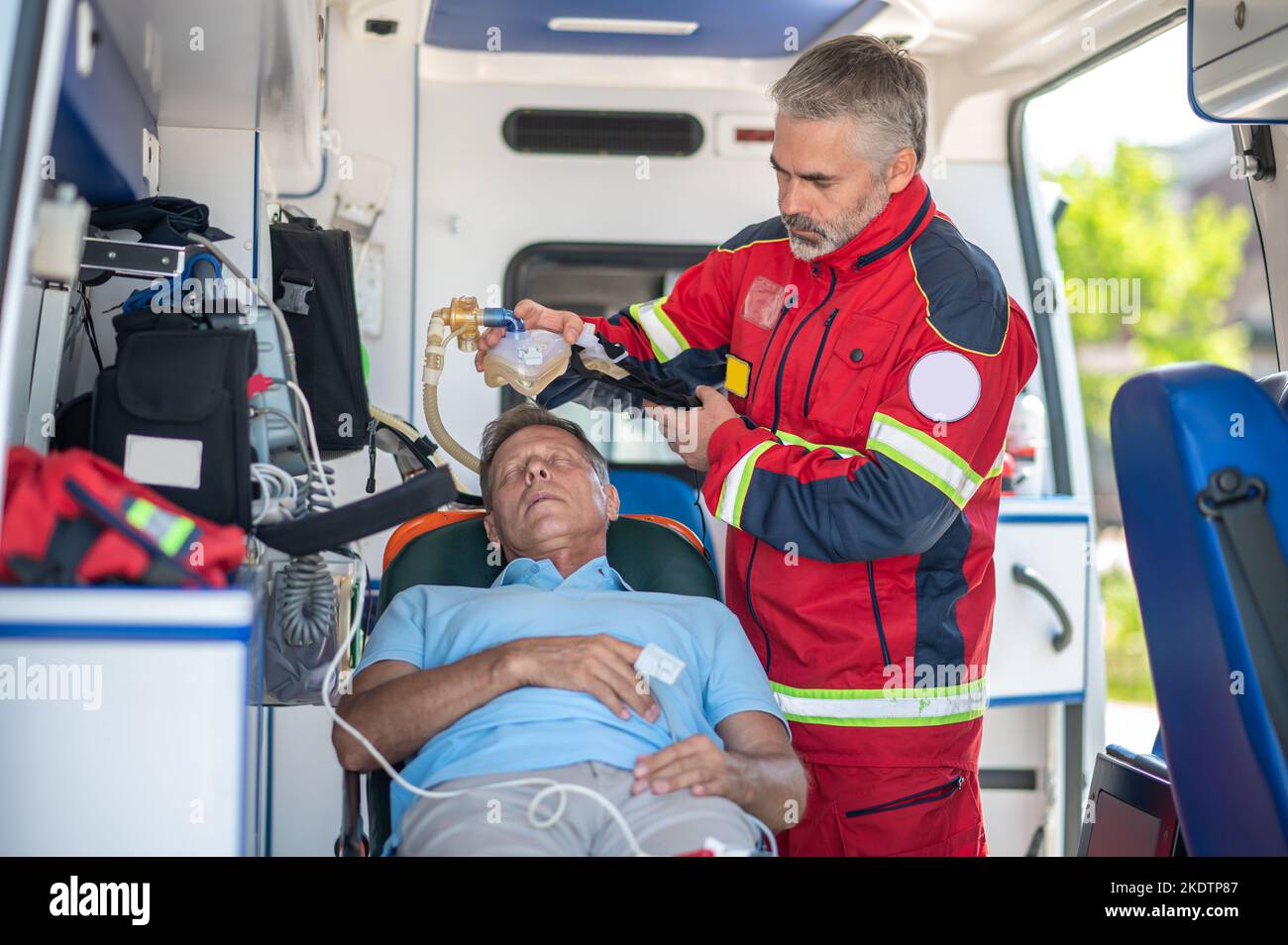 Emergency doctor preparing the patient for oxygenation Stock Photo - Alamy