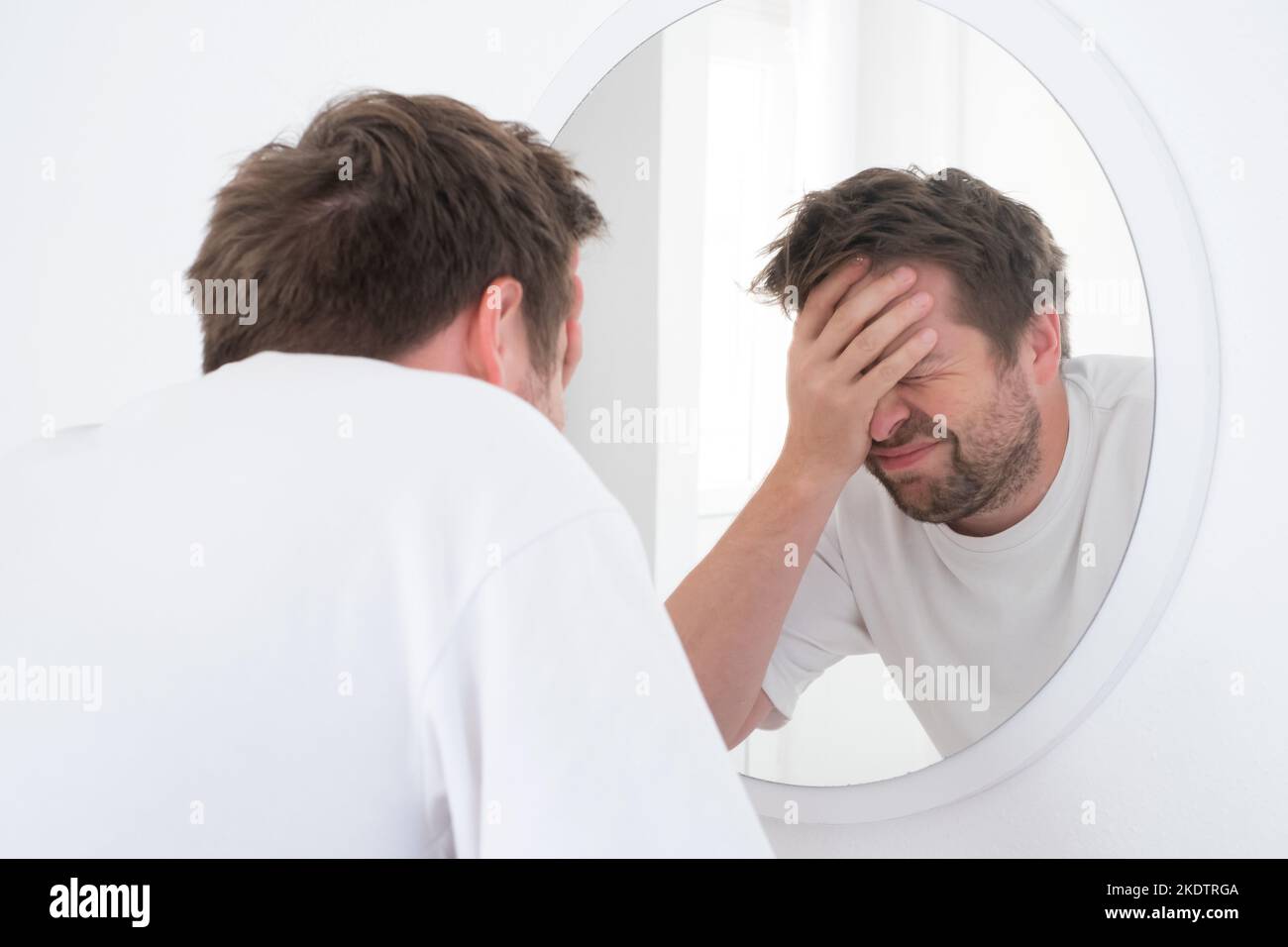 Depressed man looking mirror hi-res stock photography and images - Alamy
