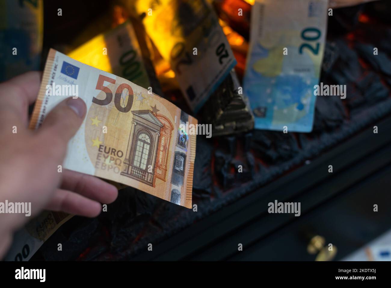 Money burns. Euro banknotes burning in flames Stock Photo - Alamy